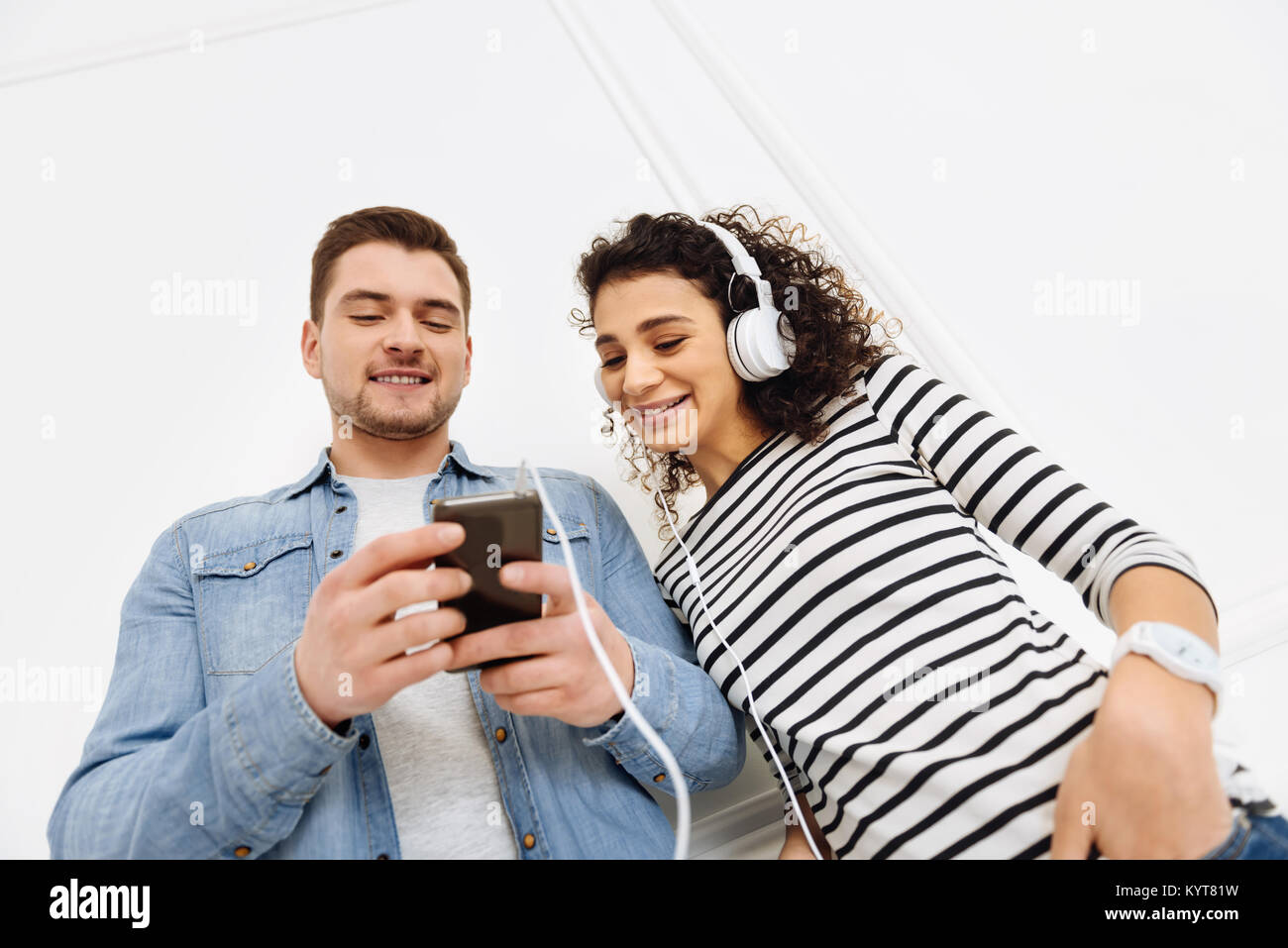 Joyful young people listening favorite song Stock Photo - Alamy