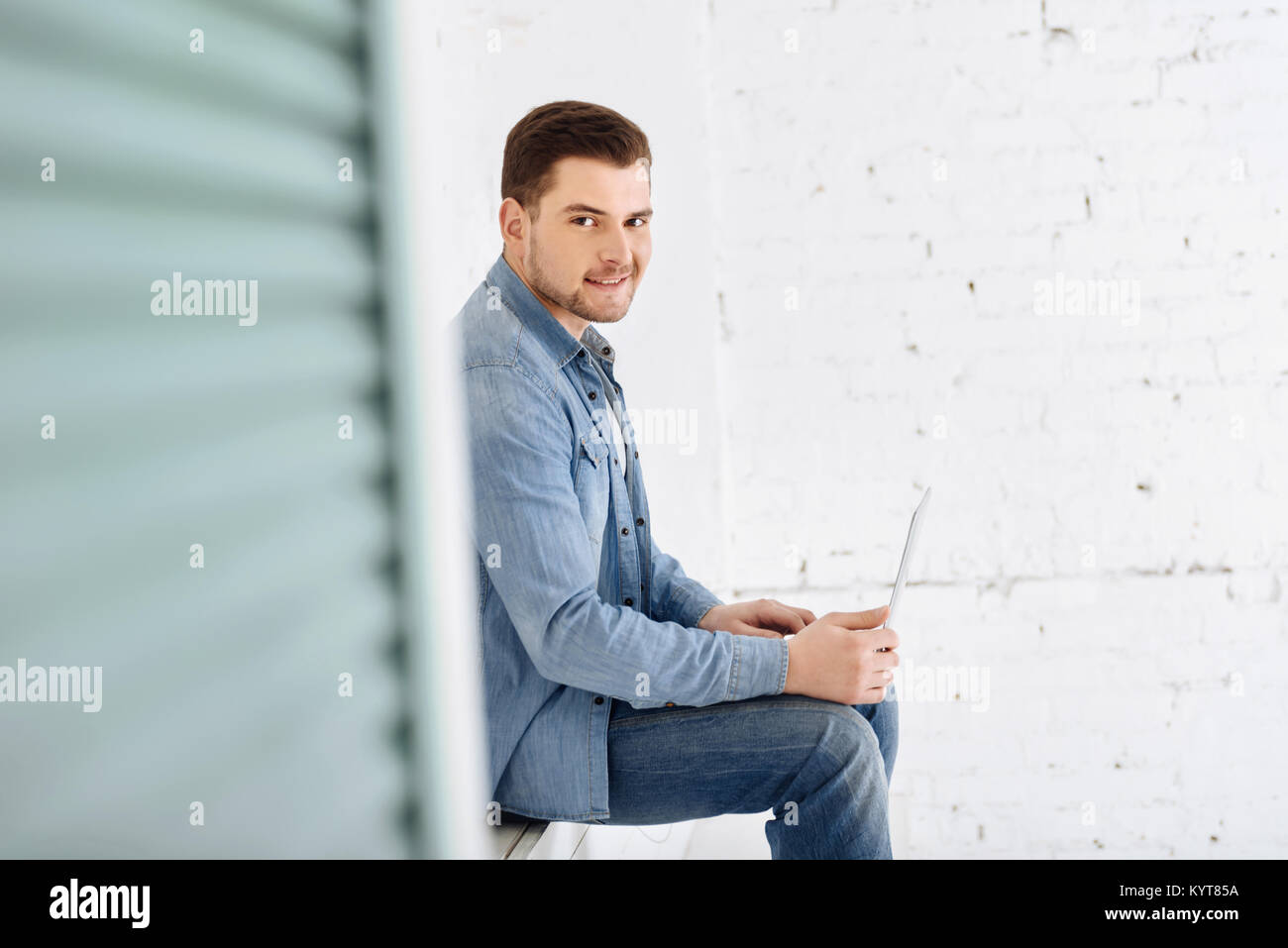 Attractive young man looking forward Stock Photo - Alamy