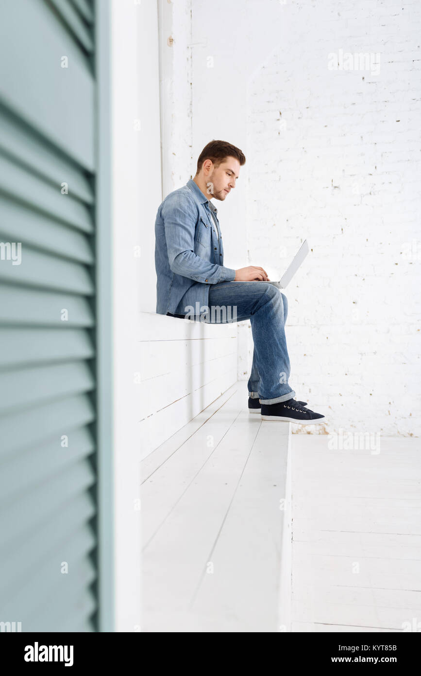 Profile photo of serious man while working Stock Photo - Alamy