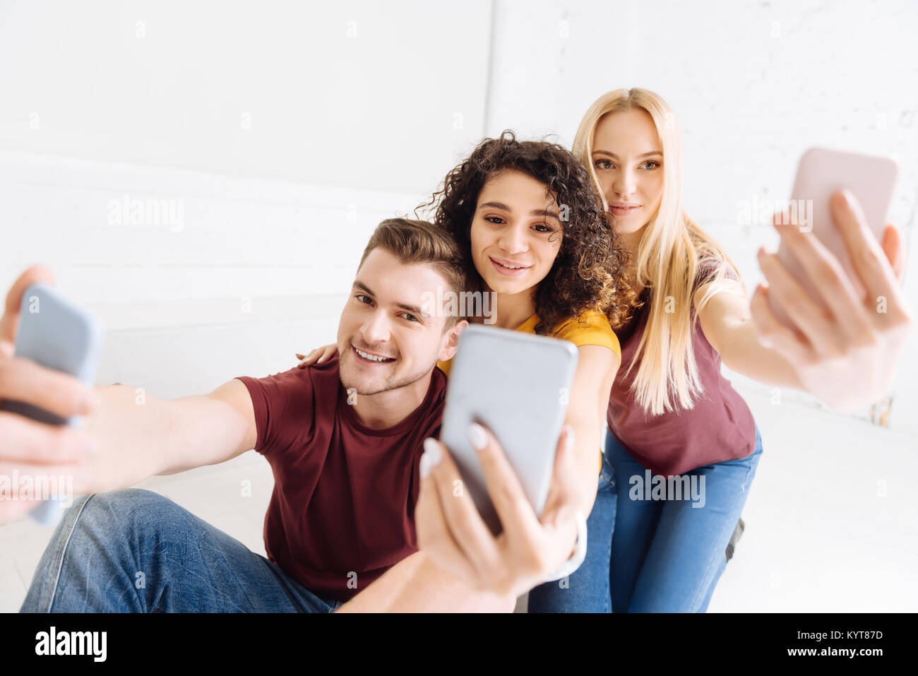 Smiling male person posing on cameras Stock Photo - Alamy