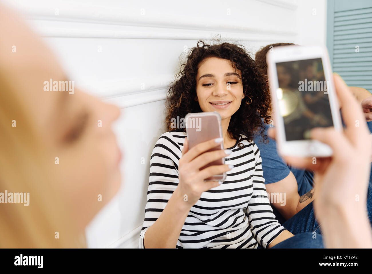 Positive delighted brunette girl taking picture Stock Photo - Alamy