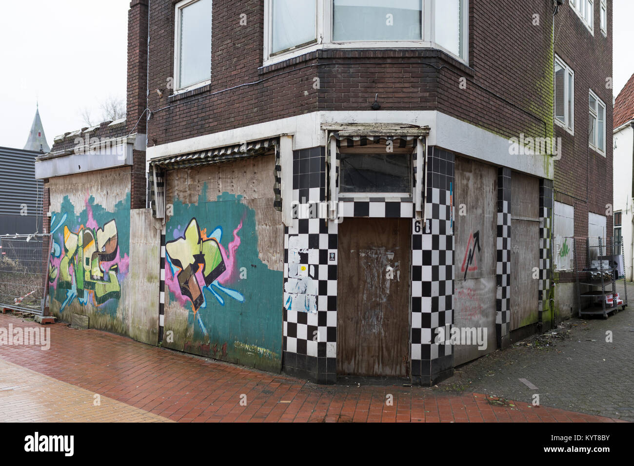 Closed shop with boarded shop window in shopping street inner city of ...