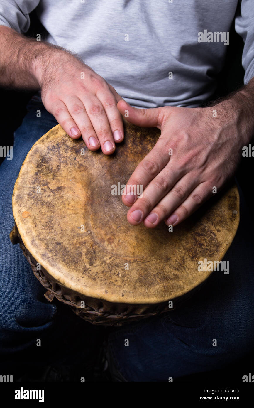Man playing african djembe drum Stock Photo - Alamy