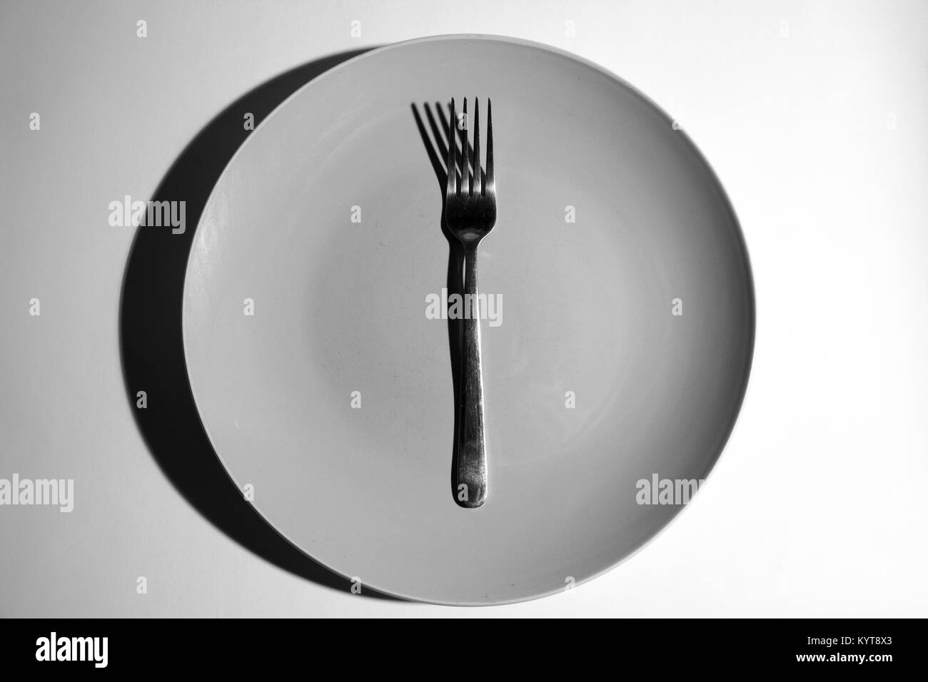 Fork isolated with creative shadow Stock Photo - Alamy