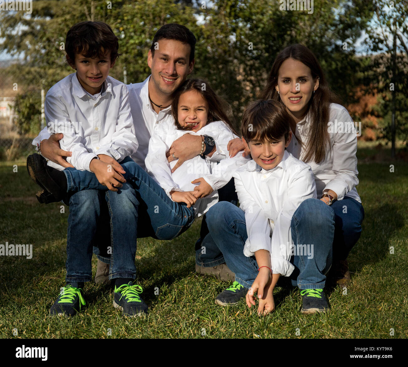 Family of many members, celebrating a party in the garden of their home ...