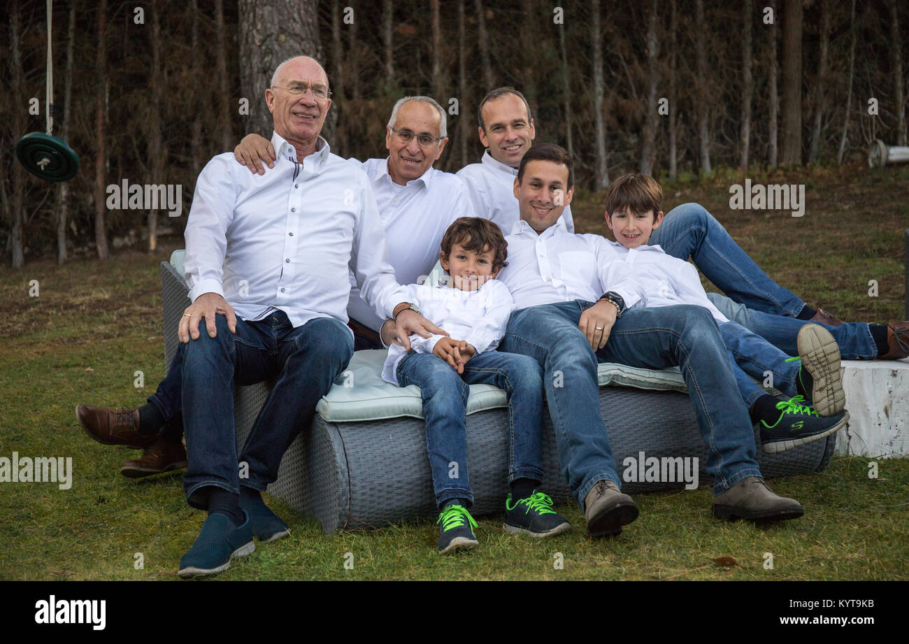 Family of many members, celebrating a party in the garden of their home ...