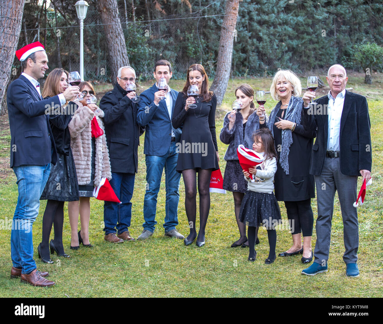 Family of many members, celebrating a party in the garden of their home ...