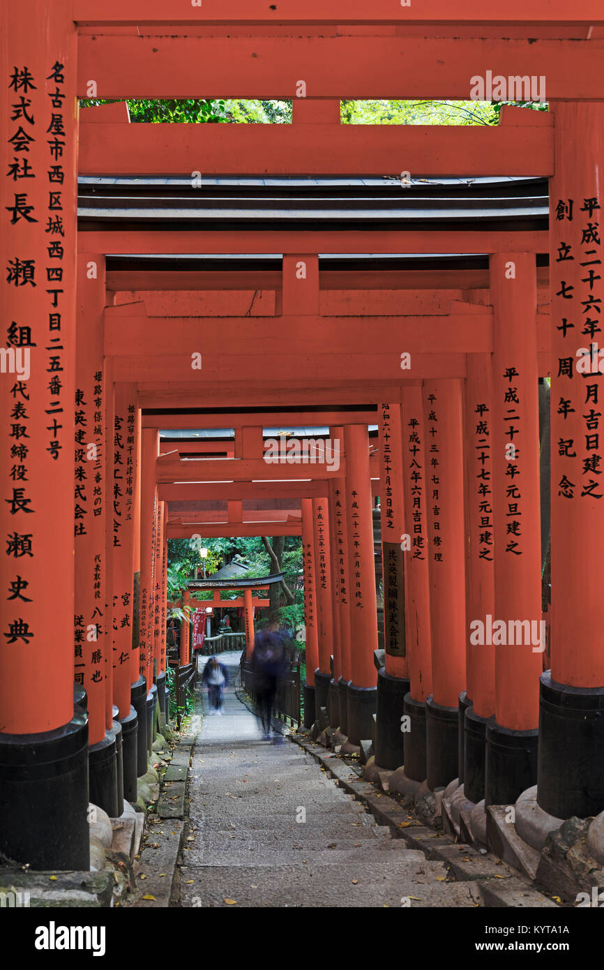 Kyoto, Japan, Nov. 9, 2017: Stone path leading through red tori ports ...