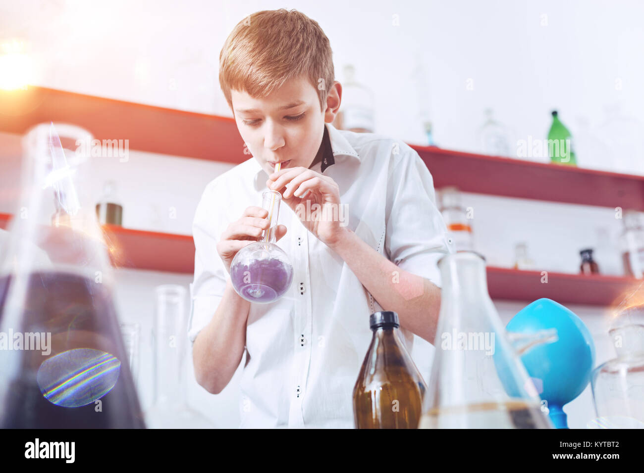 Young and talented future chemist. Focused future scientists conducting ...