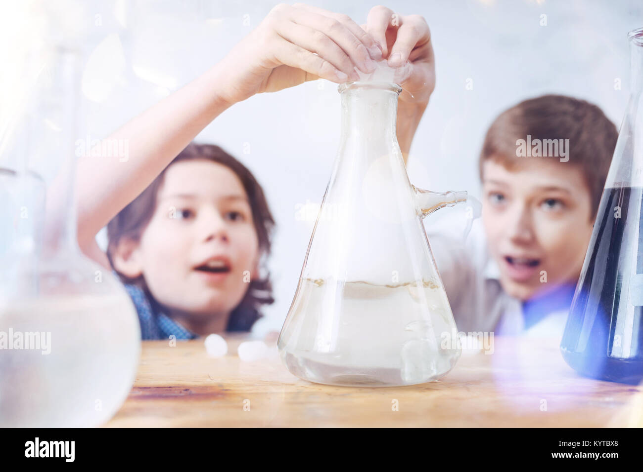 Wow magic is real. Amazed little scientists standing with slack jaws ...