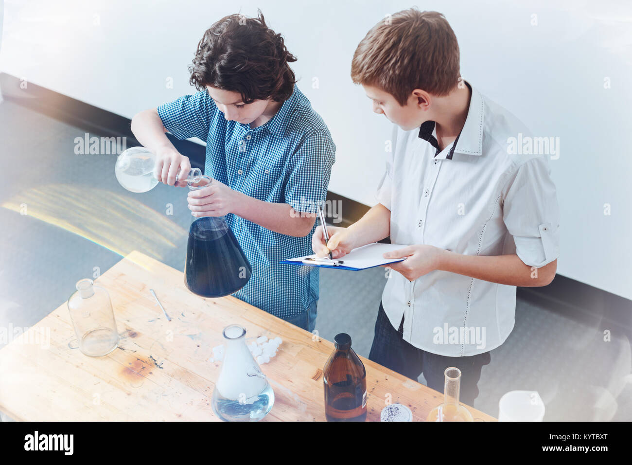 Real scientists in action. Young up and coming researches using a ...