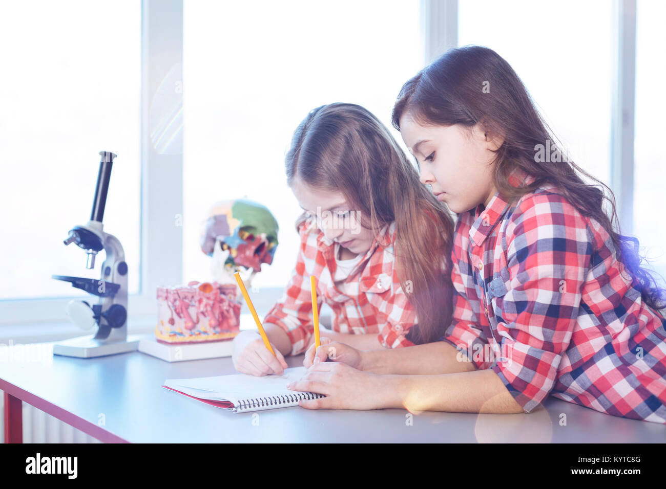 Students helping each other children hi-res stock photography and ...