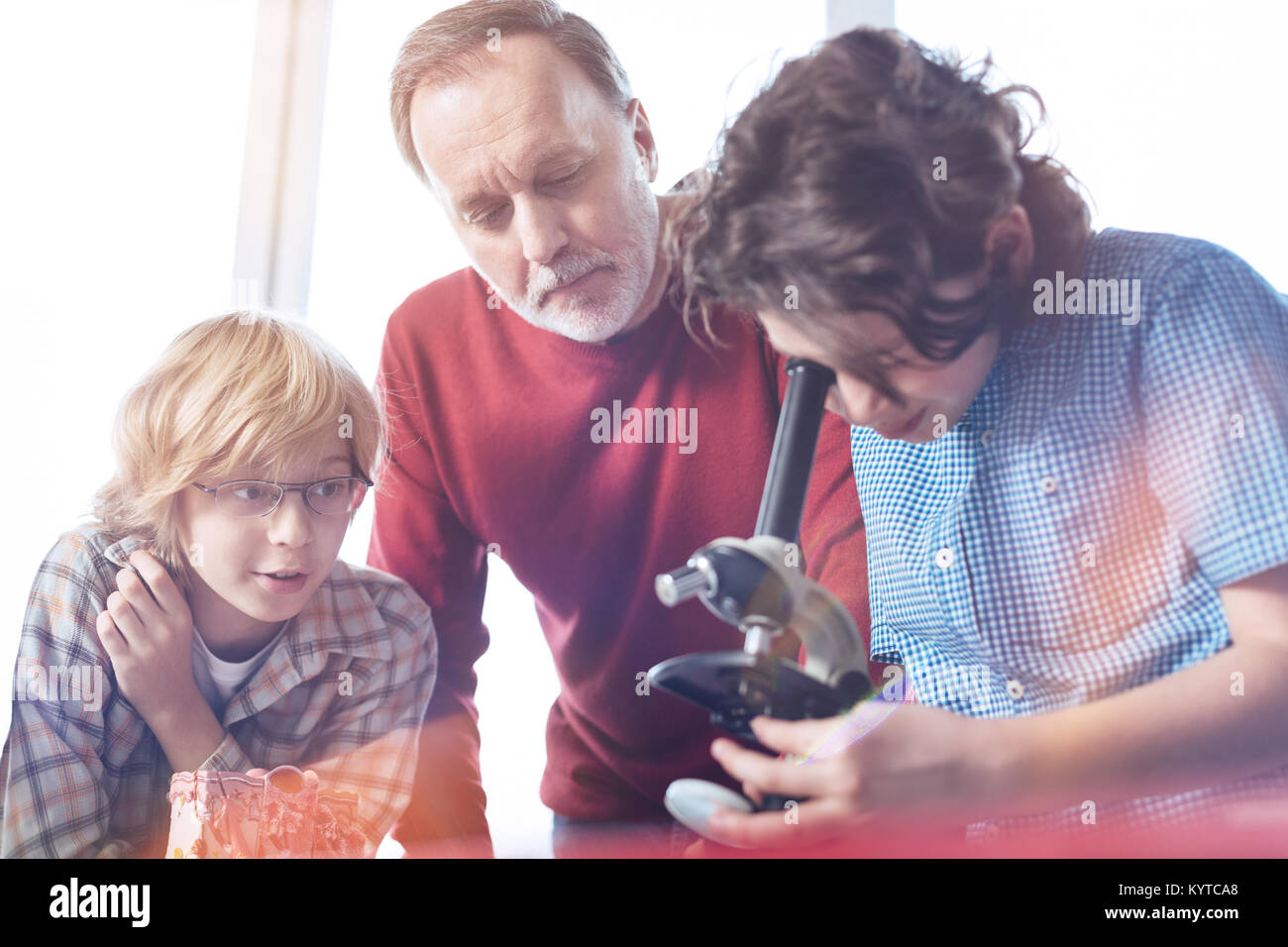 Scientific mentor. Nice attentive awesome professor guiding young boys ...