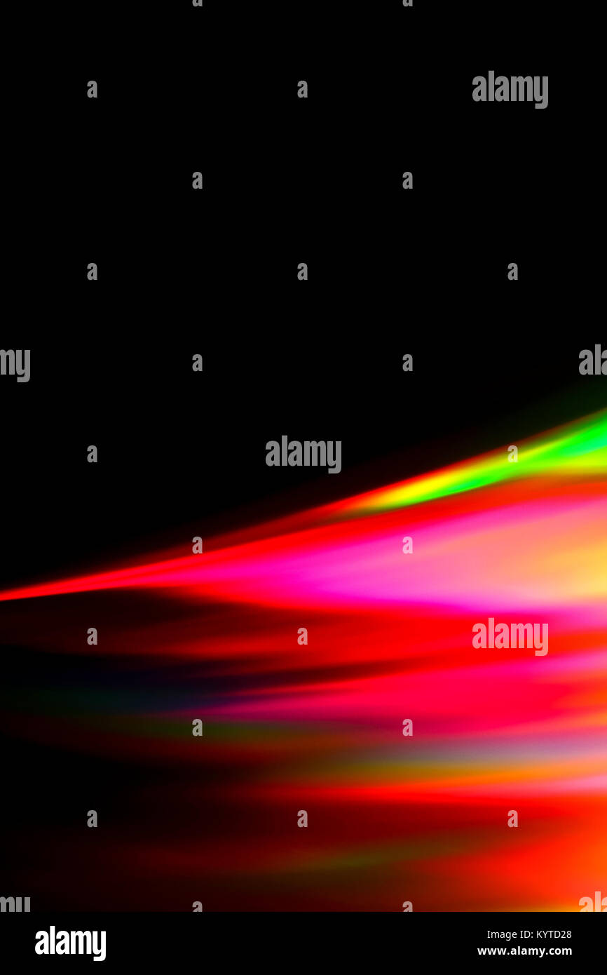 Beams of light refracting and creating a rainbow spectrum of colours ...
