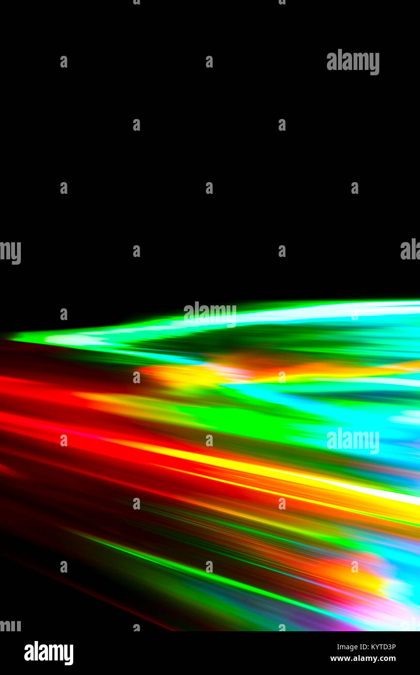 Beams of light refracting and creating a rainbow spectrum of colours ...
