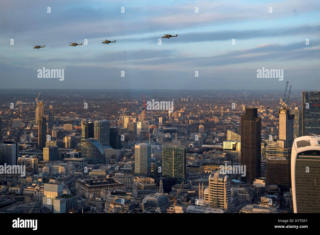 Four Lynx helicopters flying over The City in London, as seen from The ...