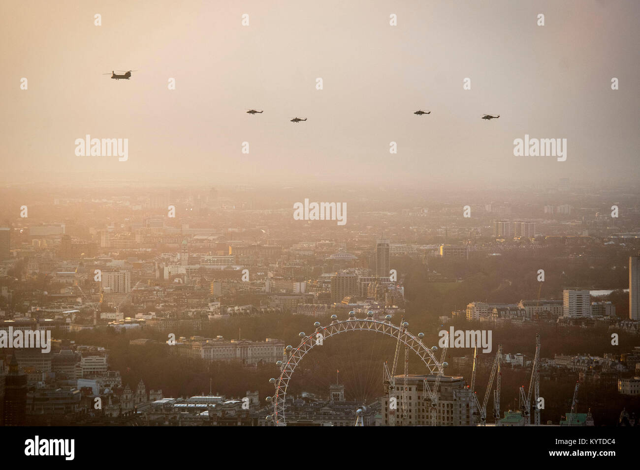 Four Lynx helicopters are escorted by a Chinook as they fly over the ...