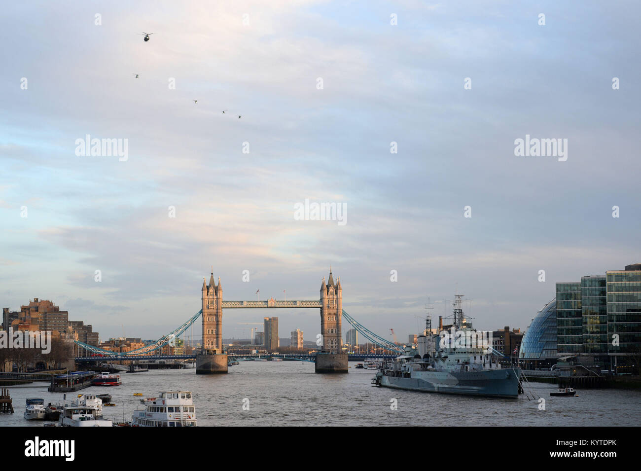 Four Lynx helicopters, escorted by a Chinook, flying over Tower Bridge ...