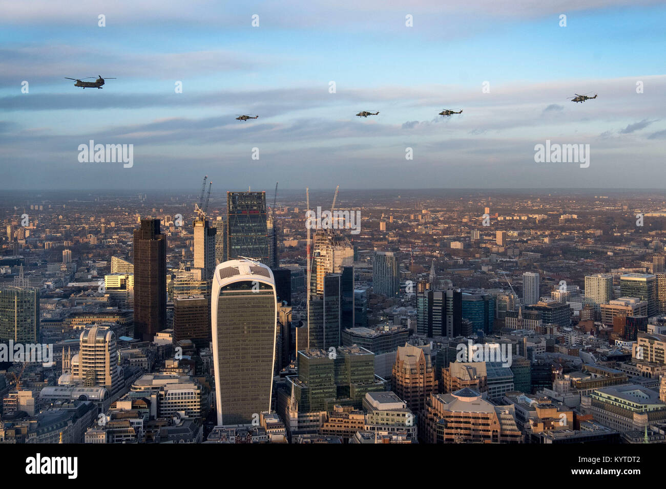 Four Lynx helicopters are escorted by a Chinook as they fly over The ...