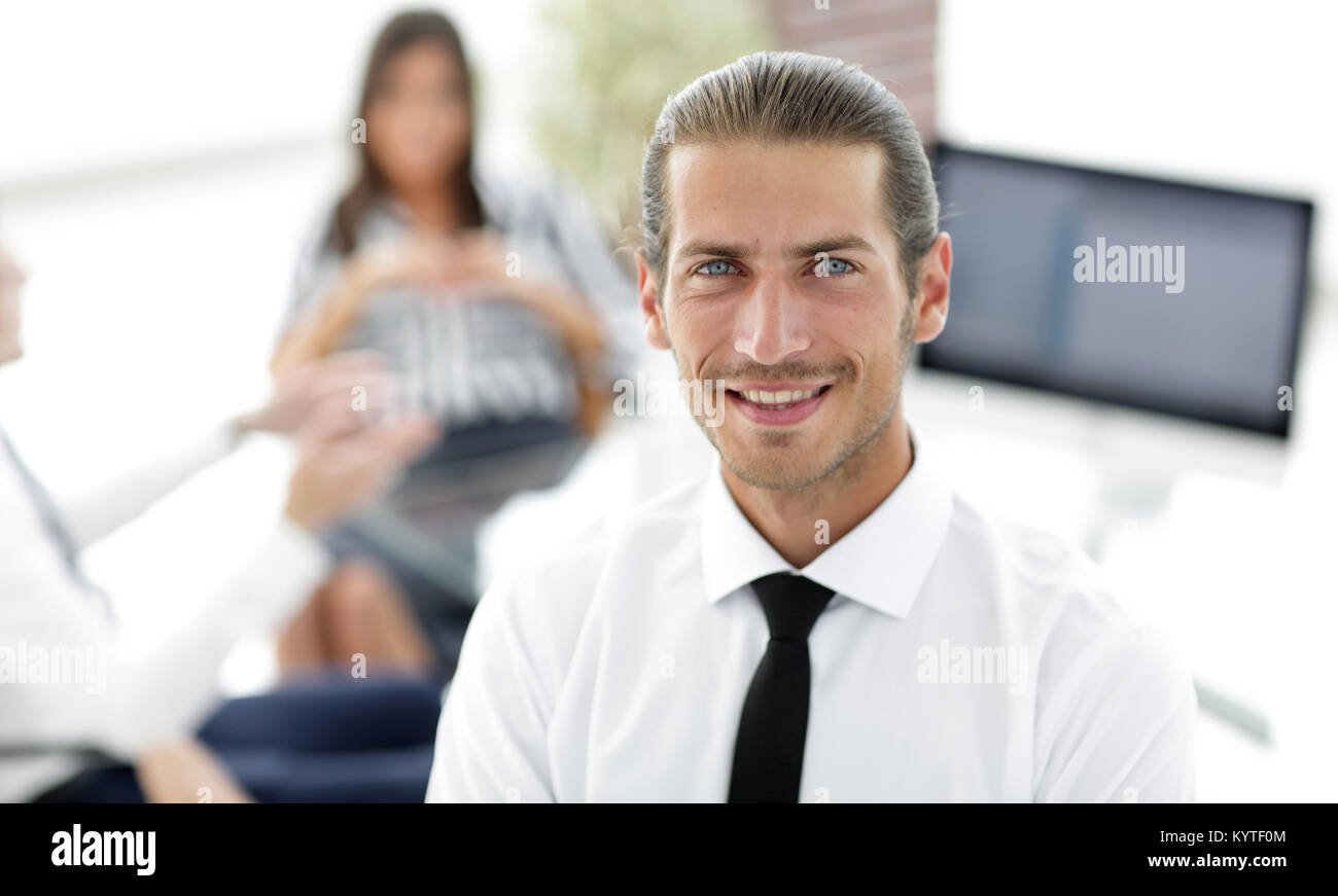 successful young business men on blurred background Stock Photo - Alamy