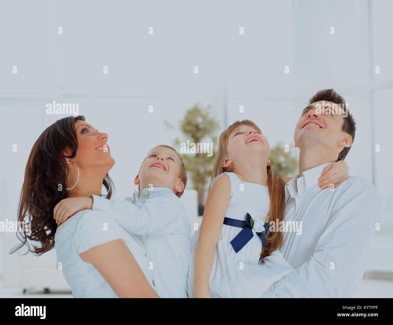 happy family looking up and smiling Stock Photo - Alamy happy family looking up and smiling Stock Photo - Alamy