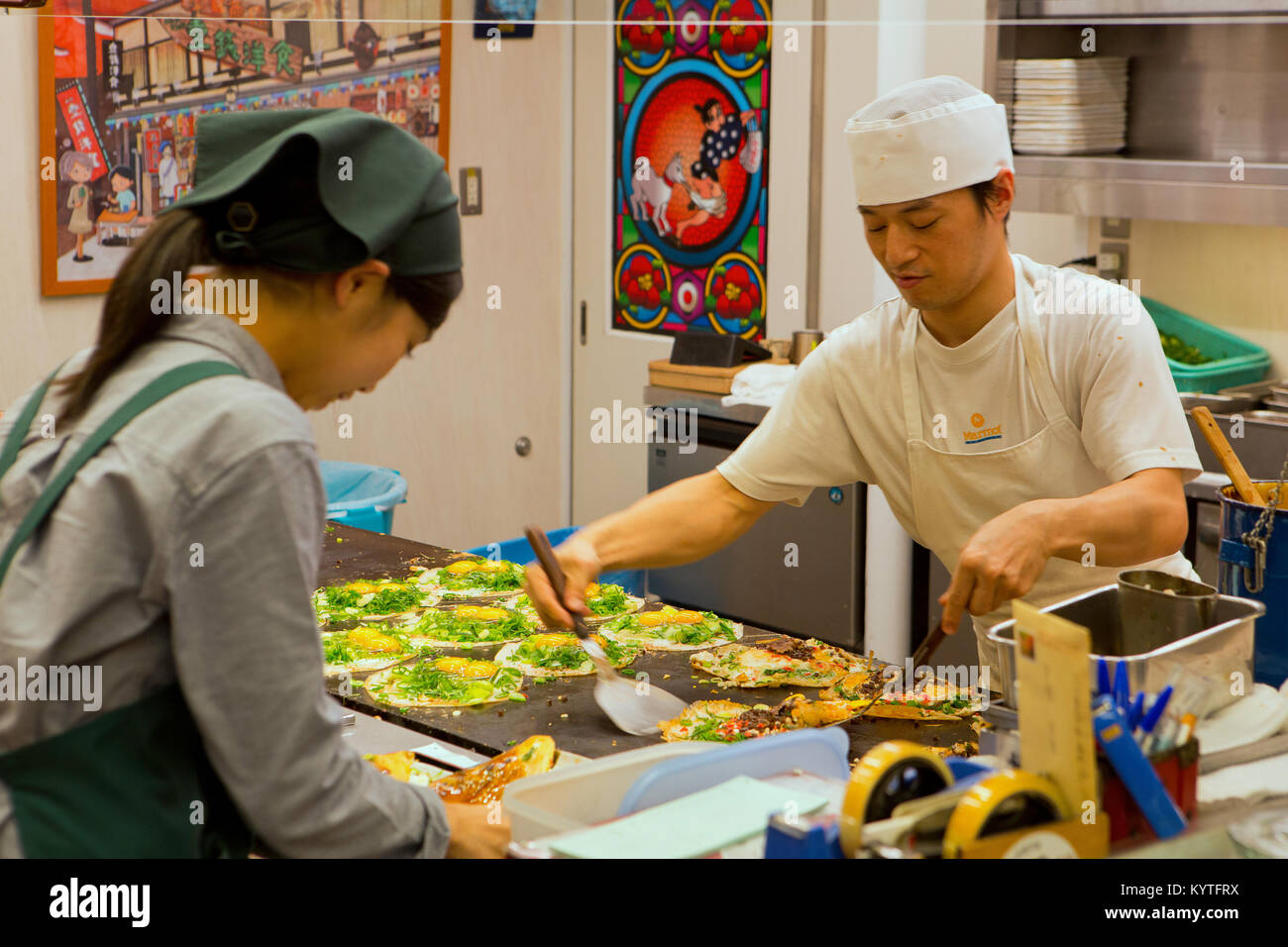 Making Okonomiyaki at a restaurant in Kyoto, Japan Stock Photo - Alamy