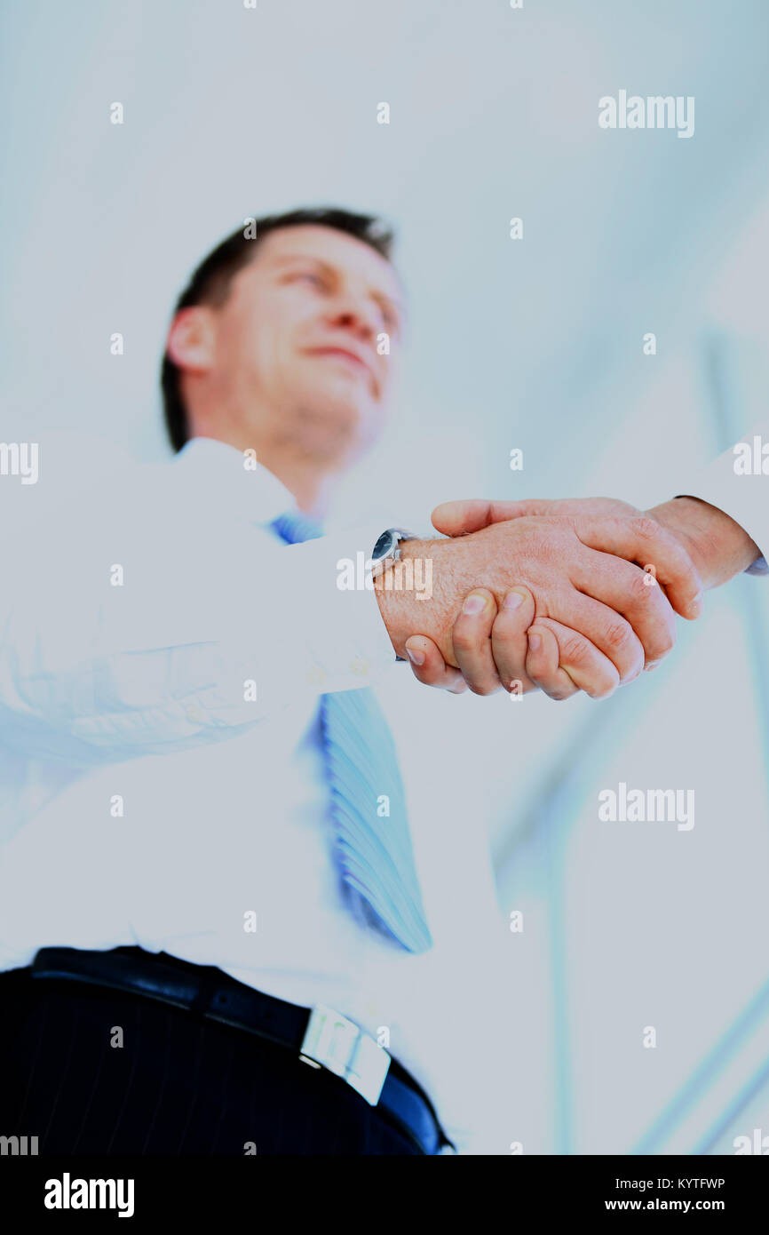 Low angle shot shake hands hi-res stock photography and images - Alamy