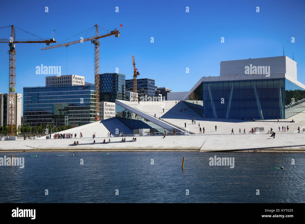 OSLO, NORWAY – AUGUST 17, 2016: Tourist on the Oslo Opera House which ...