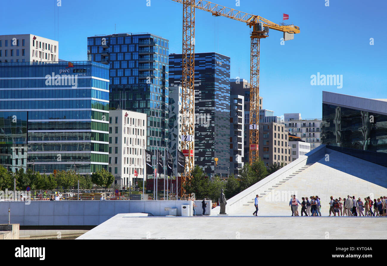 OSLO, NORWAY – AUGUST 17, 2016: Tourist on the Oslo Opera House which ...