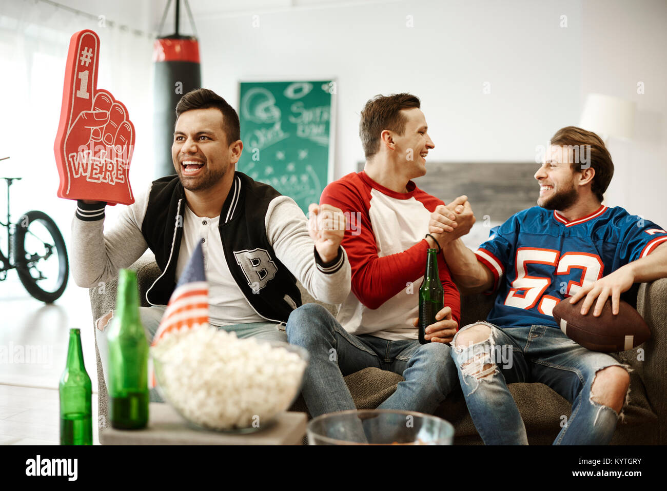 Front view of loyal and confident football fans Stock Photo - Alamy