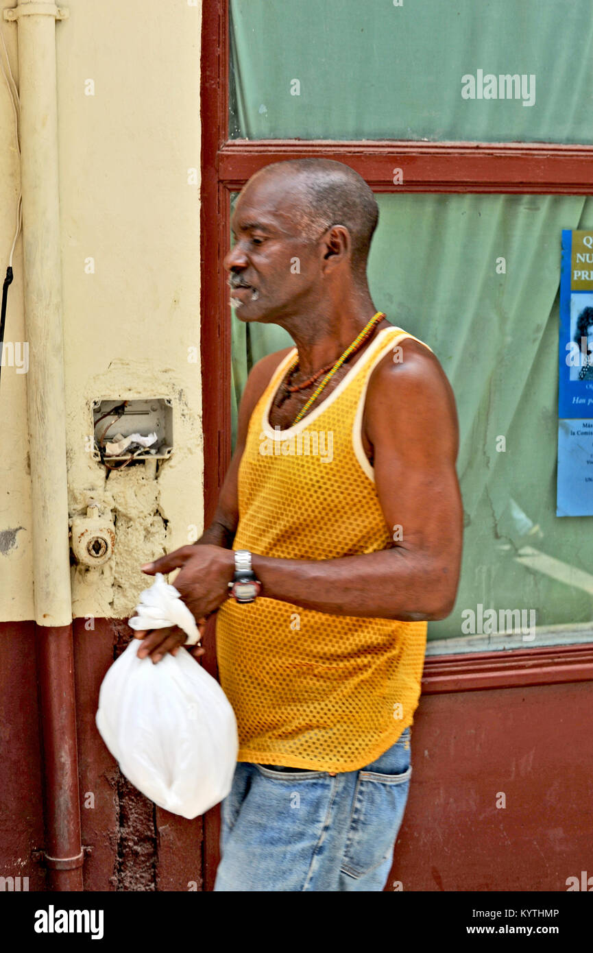 HAVANA, CUBA, MAY 6, 2009. A Cuban man hanging out on the street in ...