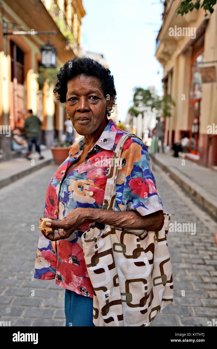 HAVANA, CUBA, OCTOBER 20, 2009. A middle aged Cuban woman standing on the street, posing, in ...