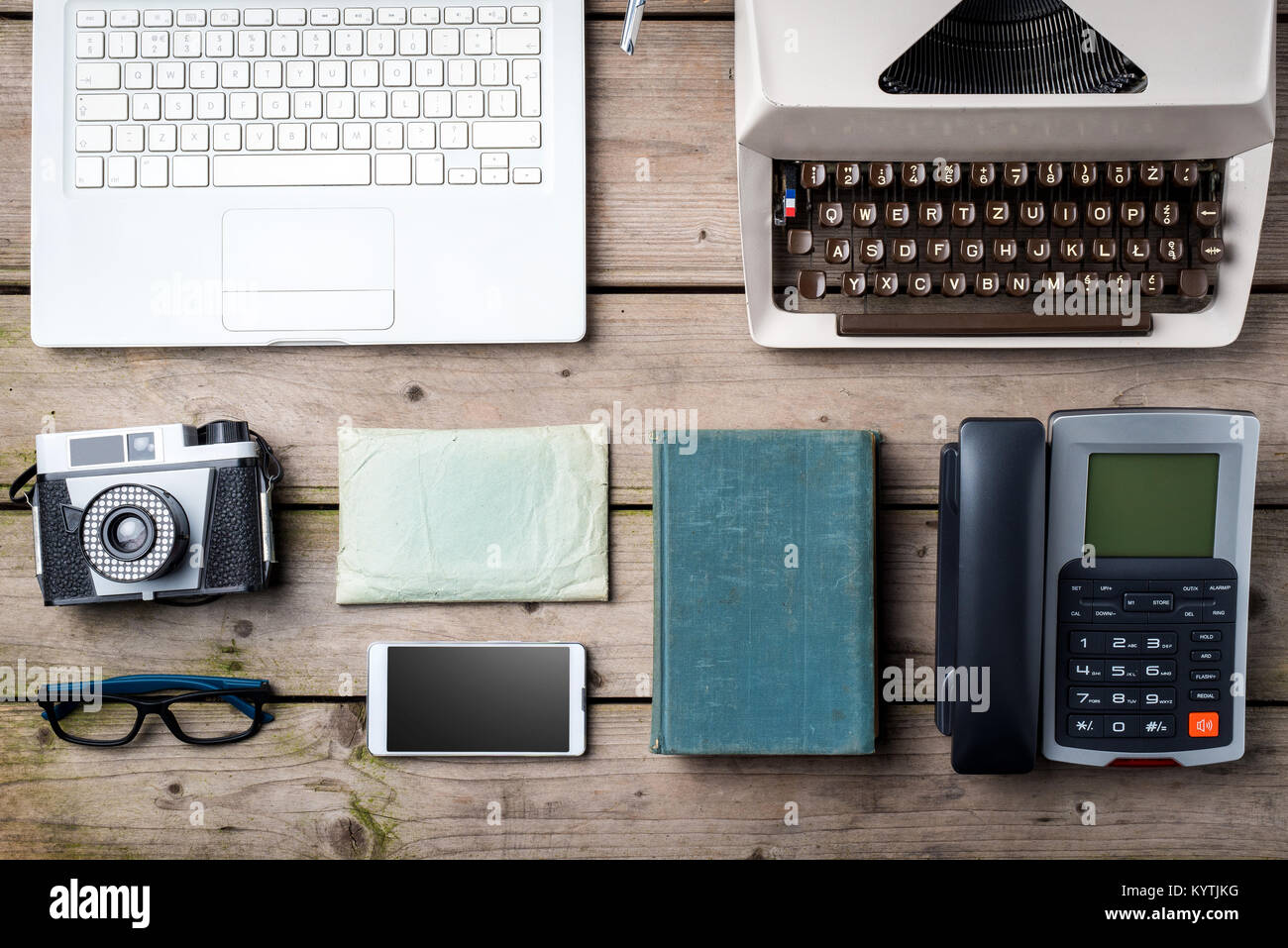 Technology progress, old and modern digital devices on wooden table ...