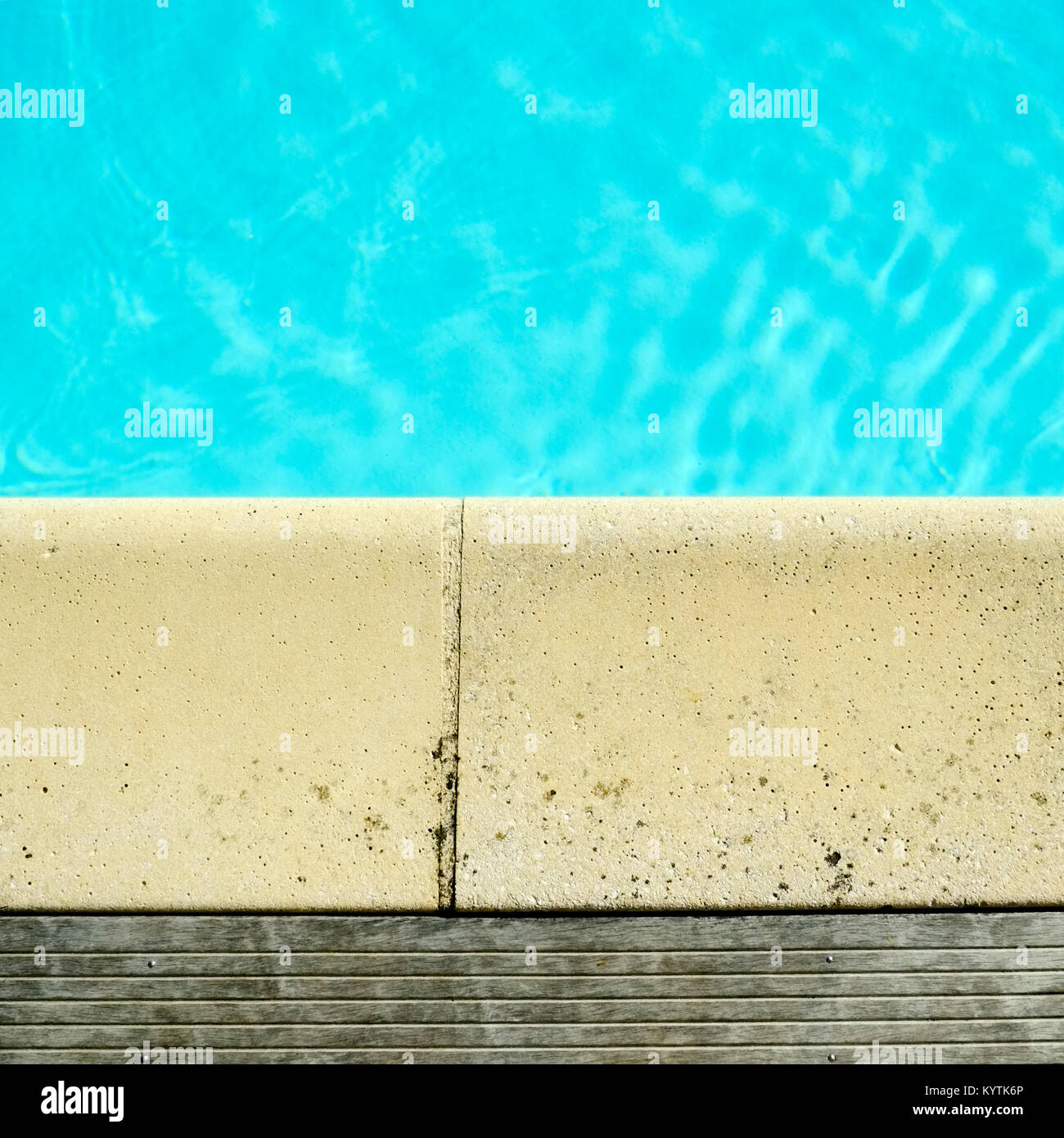 Decking and stone edging detail around a swimming pool Stock Photo - Alamy
