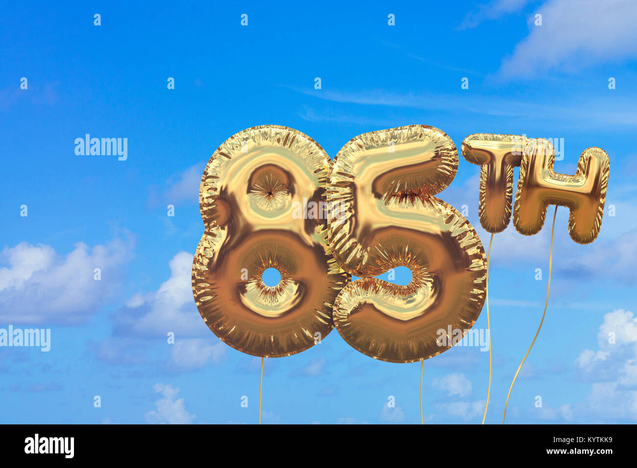 Gold number 85 foil birthday balloon against a bright blue summer sky ...