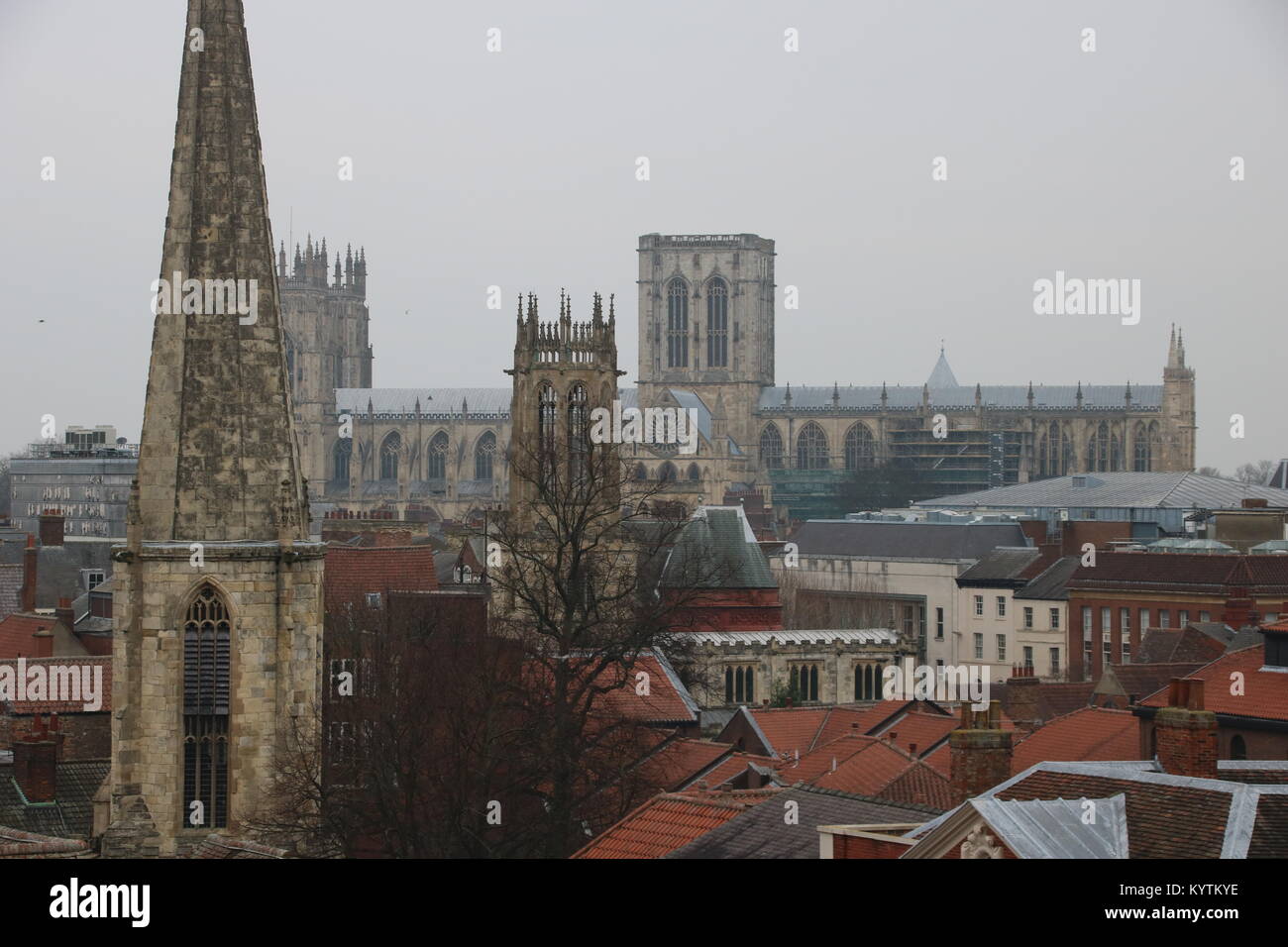 Historic York Minster towers above the roof tops of buildings in the ...