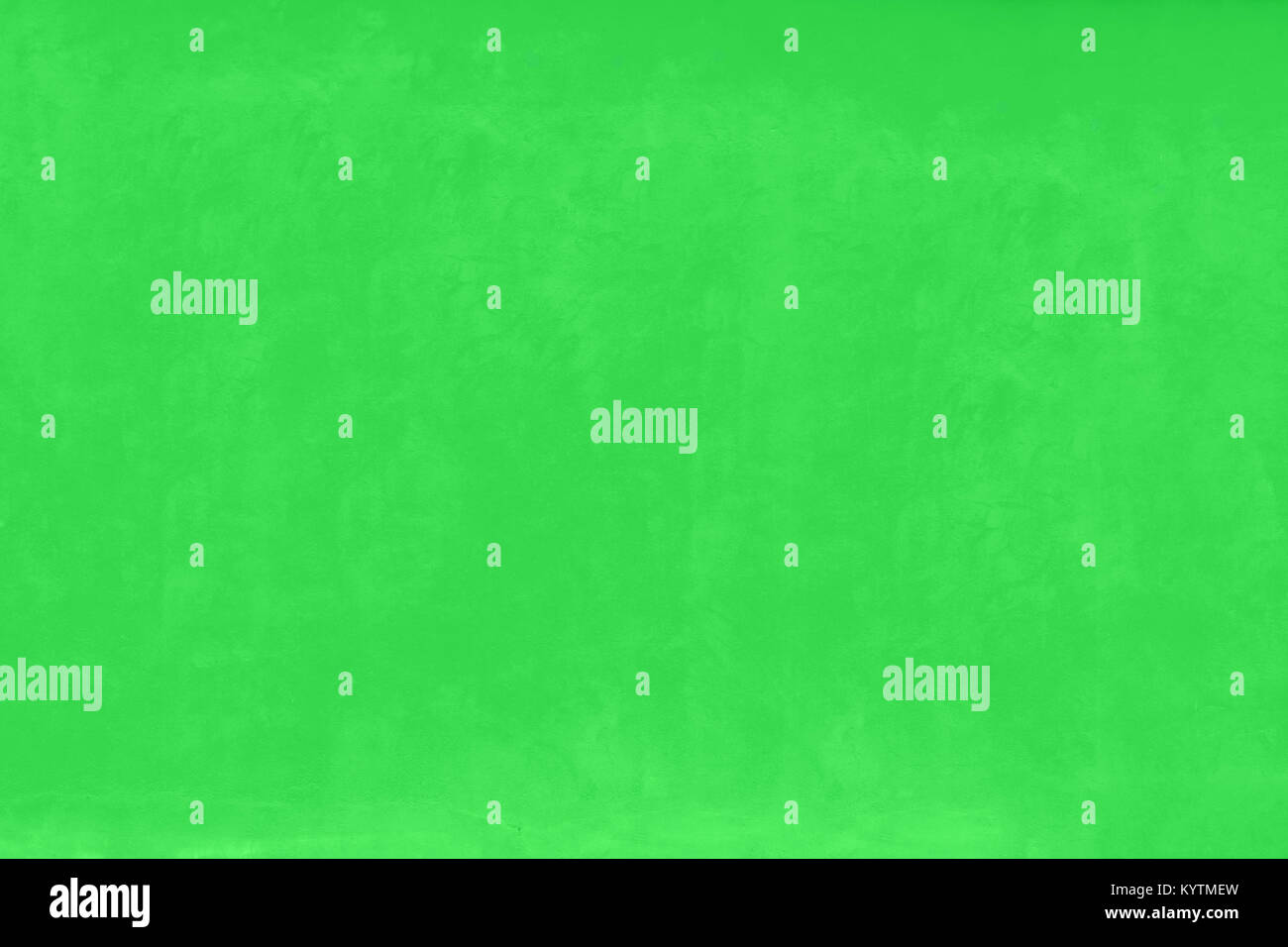 Intense green color facade wall as an empty rustic background texture ...