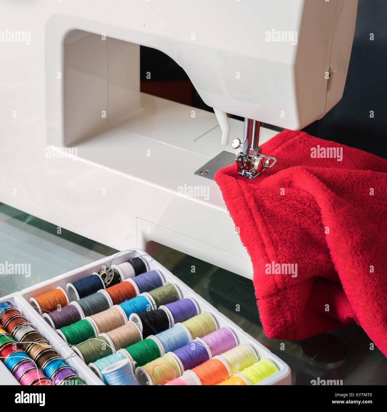 sewing machine and red cloth, sewing process in the phase of ...