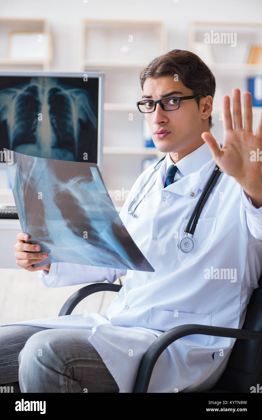 Doctor radiologist looking at x-ray images Stock Photo - Alamy