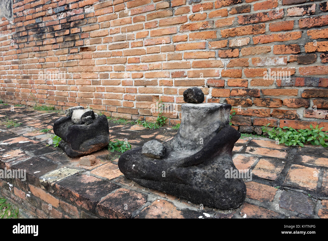 The headless Buddha statues sitting on the pedestal in the backside of ...