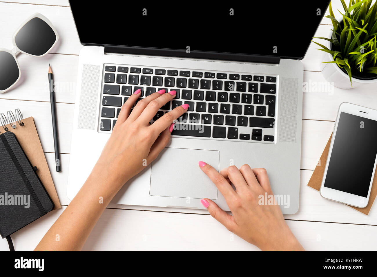 Woman using modern white laptop in office. Top view Stock Photo - Alamy