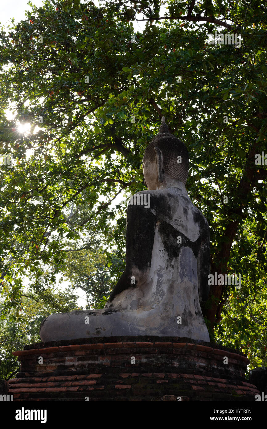 The buddha statue in meditation posture with the sunlight emitting from ...