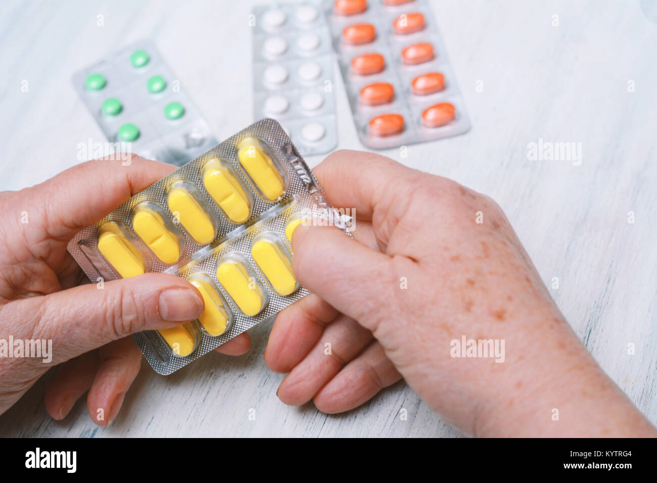 Old man holding tablet of pill. Medicine concept Stock Photo - Alamy