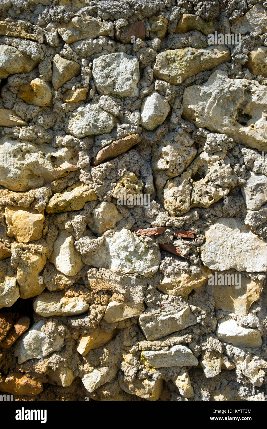 Full frame texture background of an old rubble stone wall construction ...