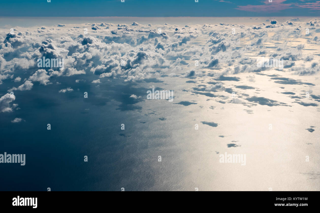 Aerial view of clouds above calm ocean close to sunset Stock Photo - Alamy
