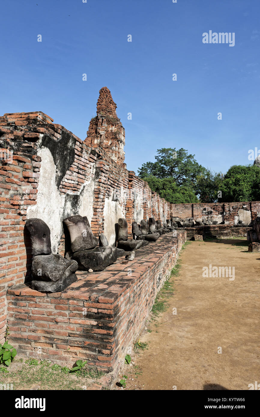The headless Buddha statues sitting on the pedestal in the backside of ...