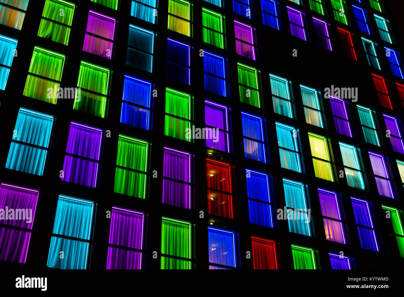Colored windows texture. Windows illuminated by neon lights background ...