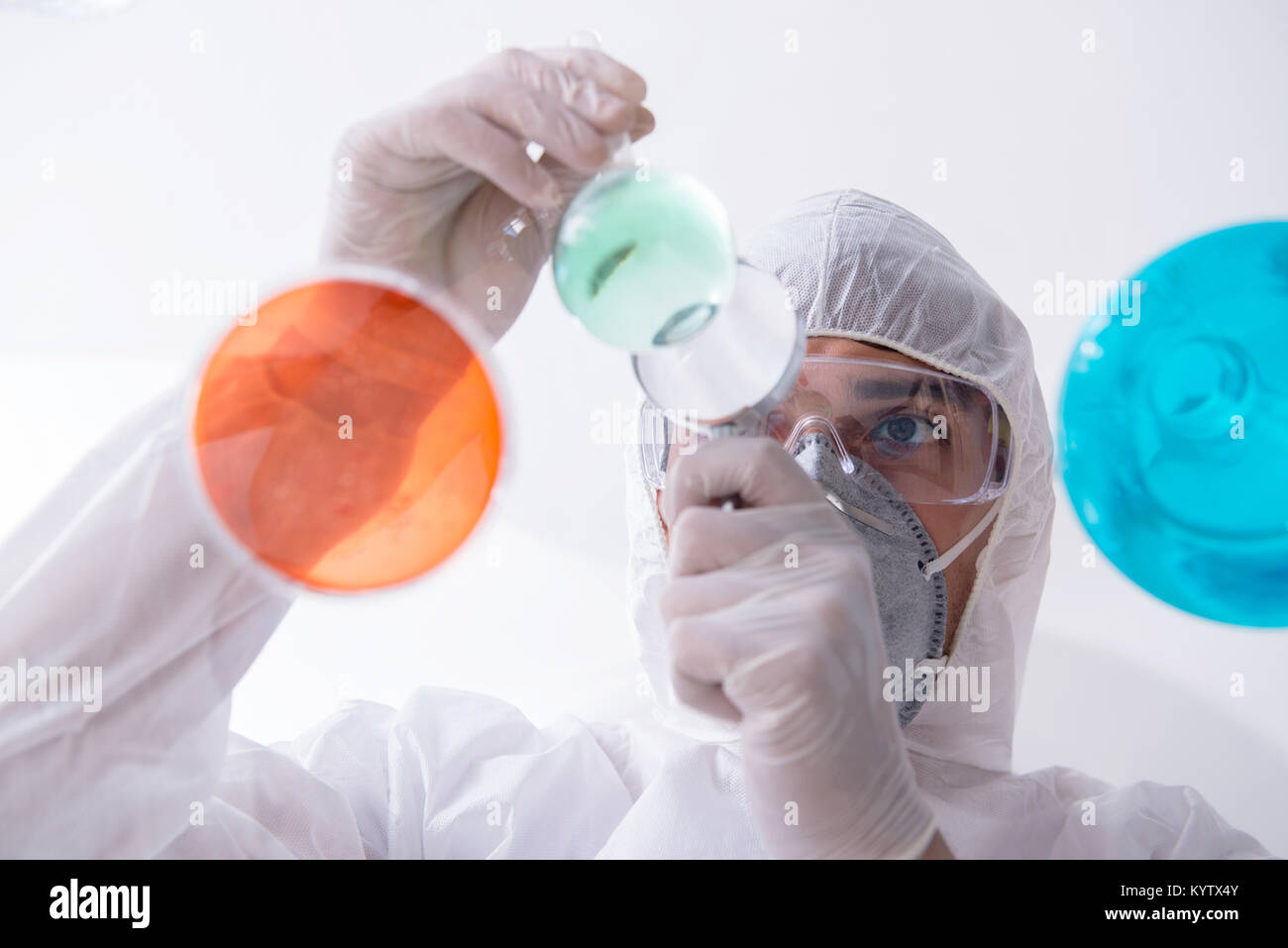 Chemist working in the laboratory with hazardous chemicals Stock Photo ...