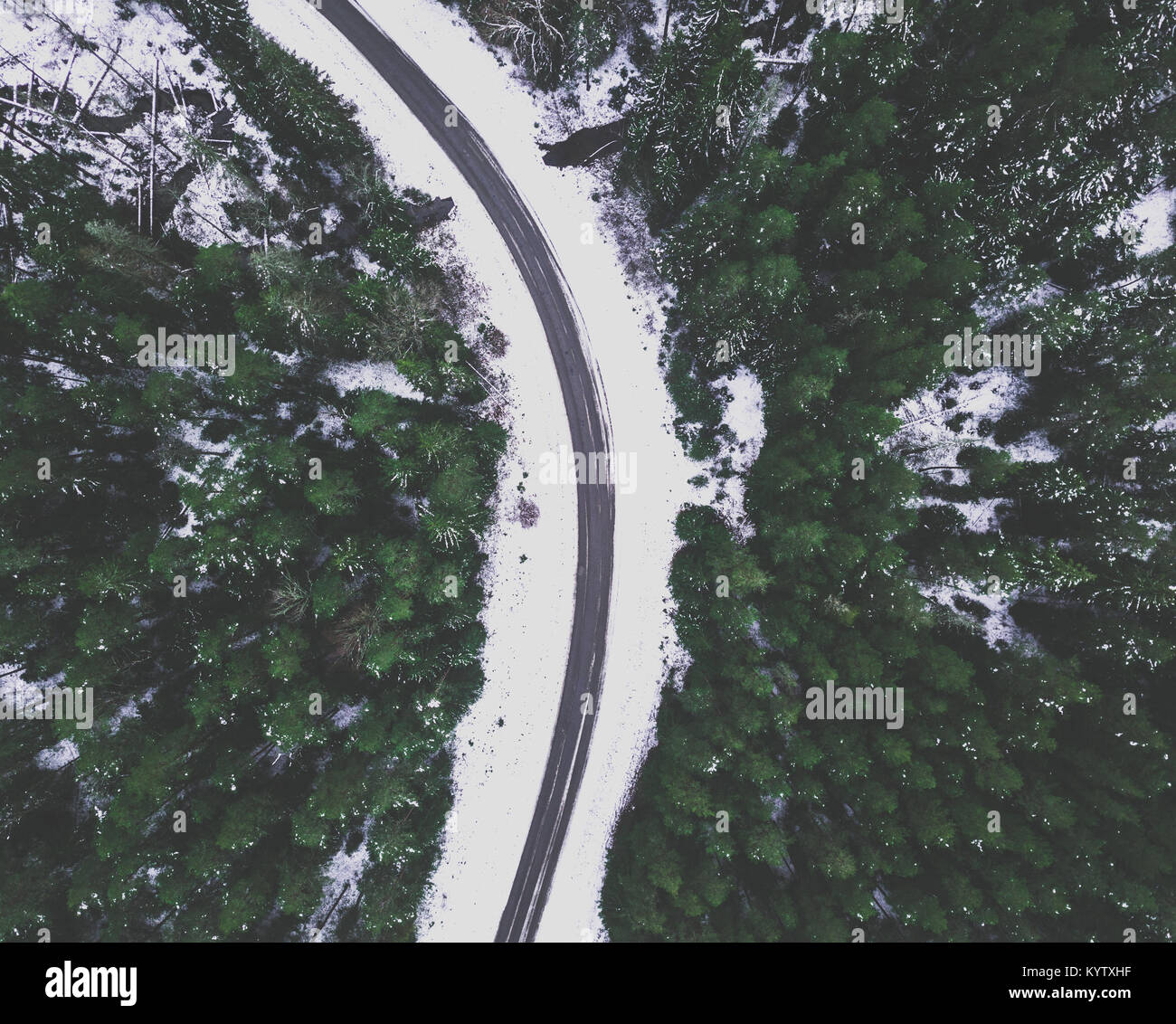 Aerial Drone Photography of a Road in Winter, Between Woods with a Snow ...