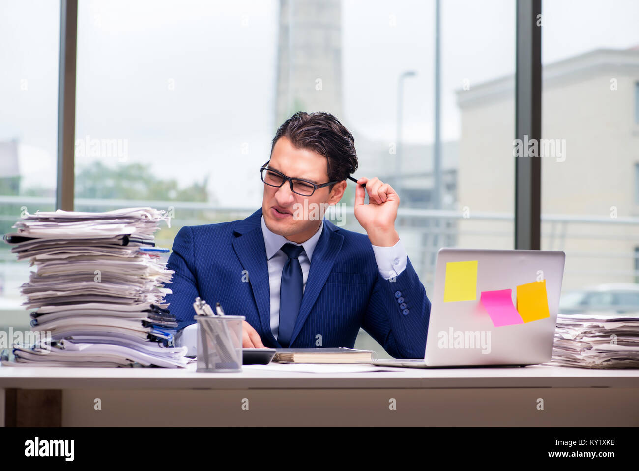 Workaholic businessman overworked with too much work in office Stock ...